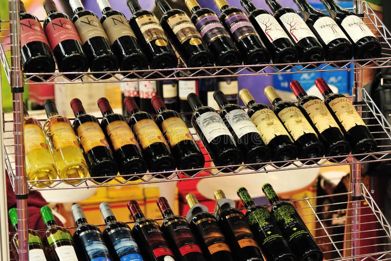 Bottled red wines on shelf editorial photography. Image of ibec - 26616307