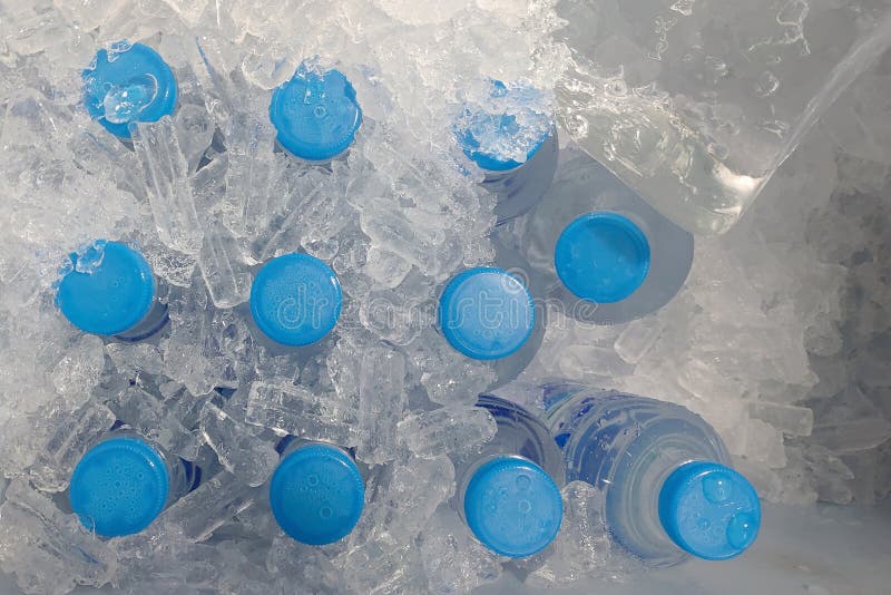 Bottled Water is Put in a Plastic Bucket with Ice Ready To Drink Stock ...
