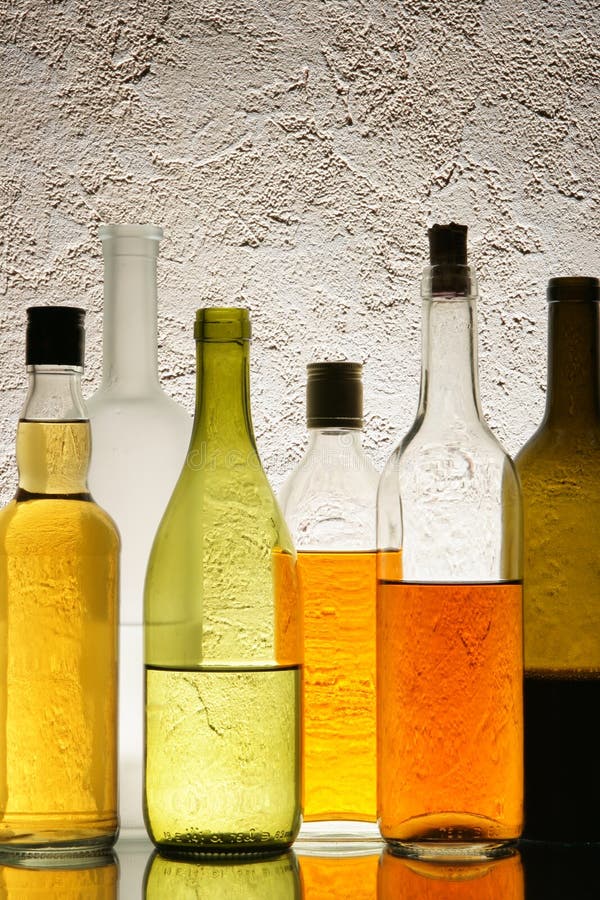 Bottles of alcohol stock image. Image of closeup, glare - 16435617
