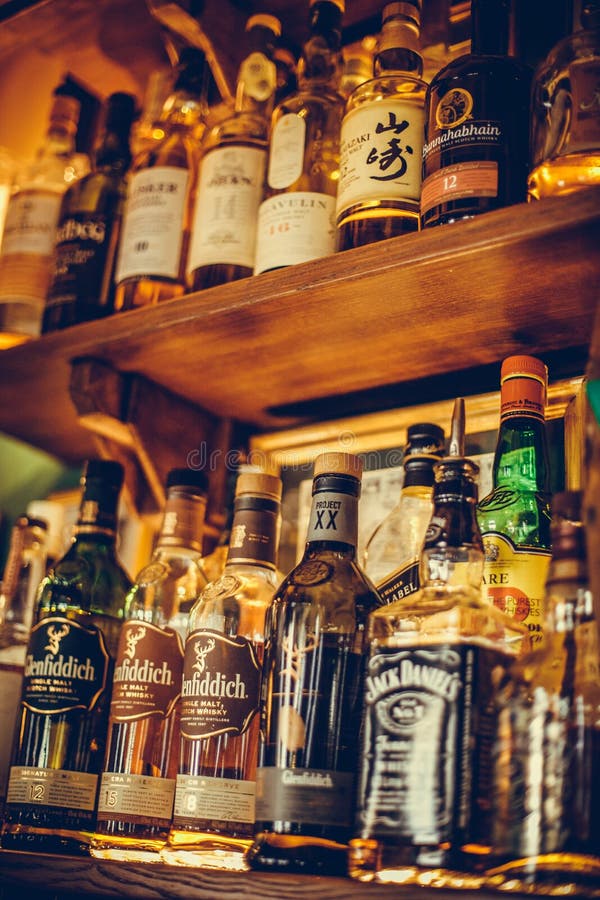 Bottles of Alcohol in a Bar Editorial Stock Image - Image of drink ...