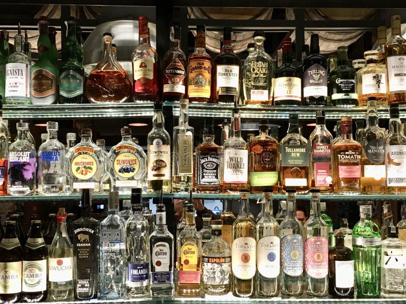 Bottles of Alcohol in a Bar Editorial Stock Image - Image of shop ...