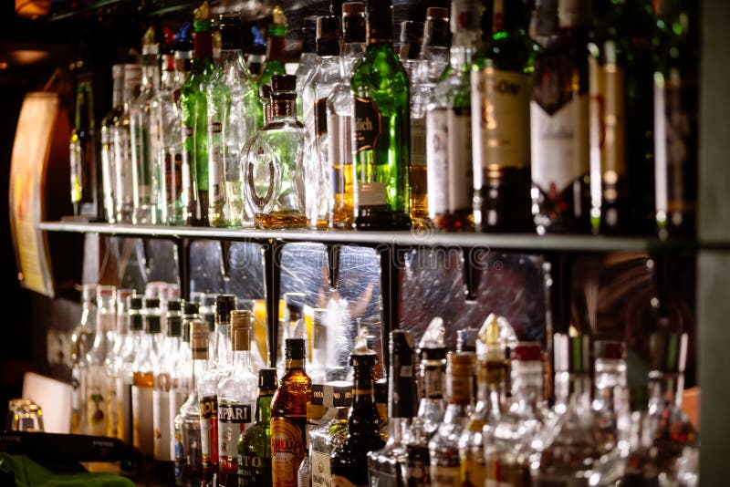 Bottles of alcohol editorial photography. Image of establishment - 80120882