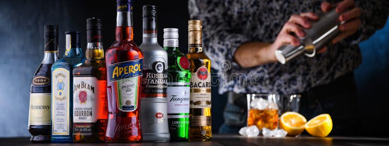 Bottles of Assorted Alcoholic Beverages and Bartender Editorial Photo ...