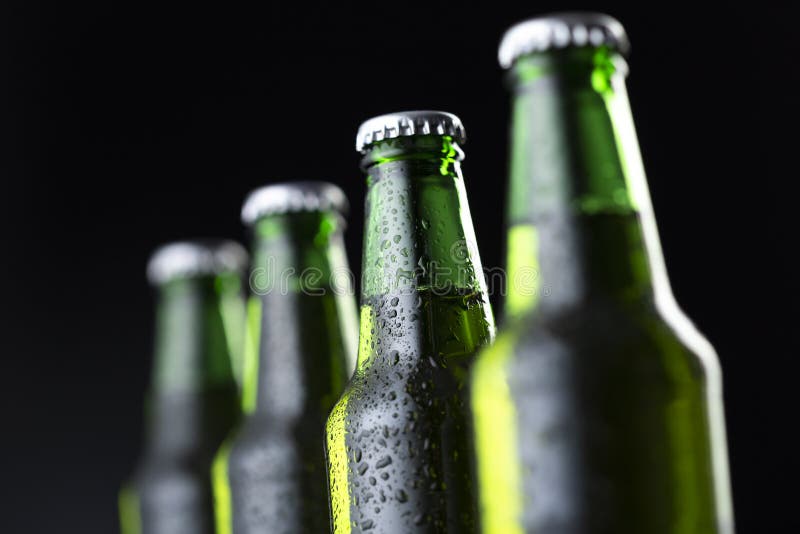 Bottles of beer in a row stock photo. Image of light - 178567876