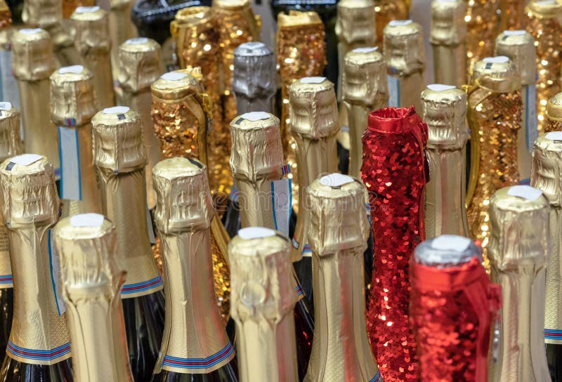 Bottles of Champagne or Sparkling Wine in Cases with Gold and Red ...