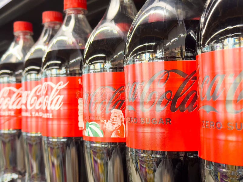 Bottles of Coca-cola on Store Shelf Displaying Various Flavors ...