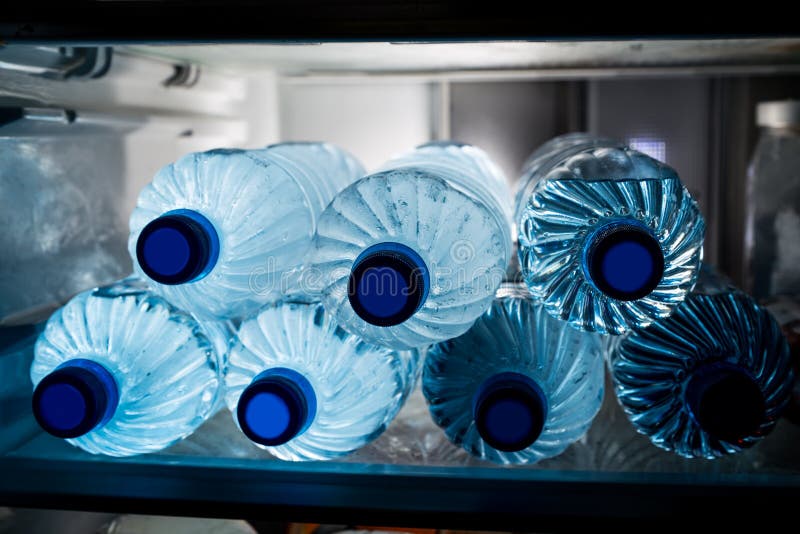 Bottles of Cold Refreshing Mineral Water in Refrigerator Stock Photo ...