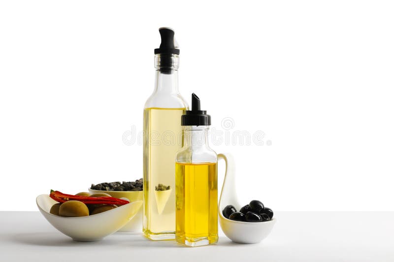 Bottles of Different Cooking Oils, Olives and Sunflower Seeds on White ...