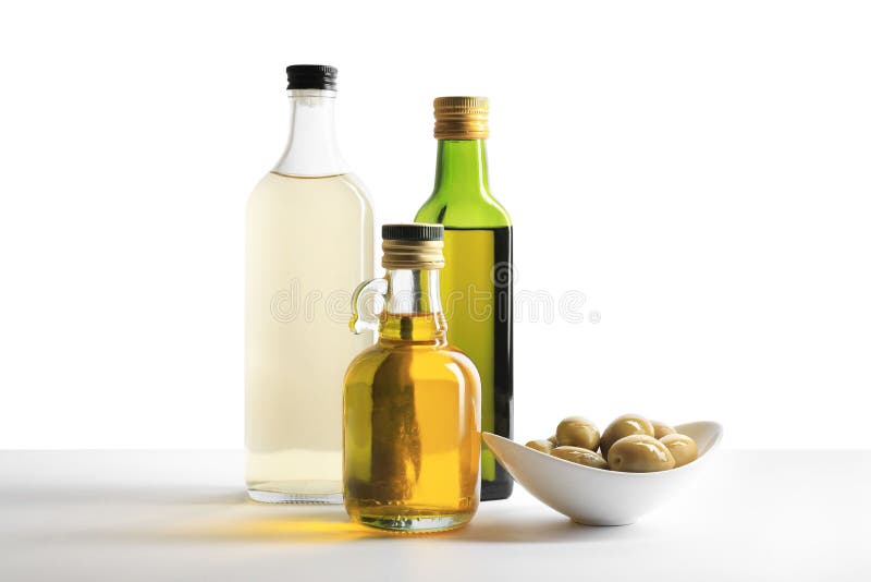 Bottles of Different Cooking Oils and Olives on White Background Stock ...