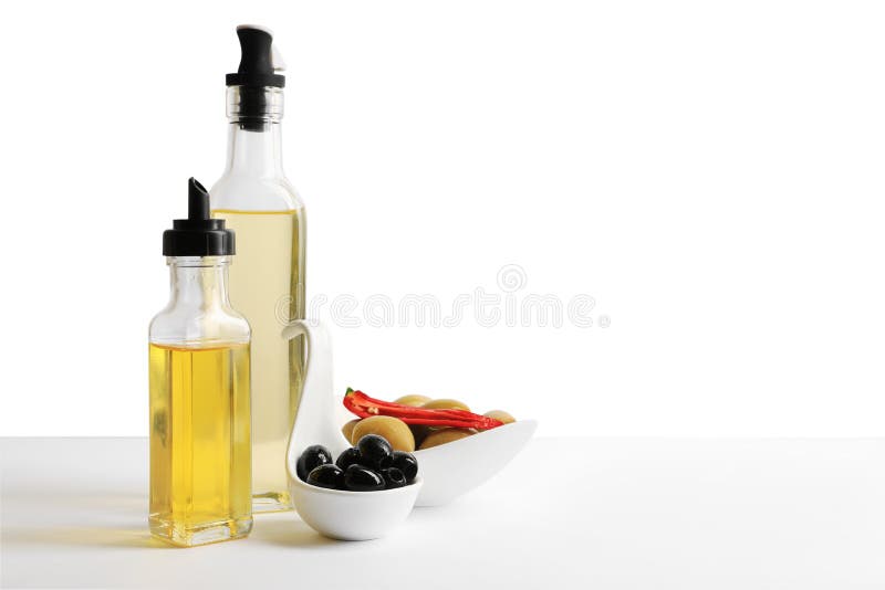 Bottles of Different Cooking Oils and Olives on White Background Stock ...