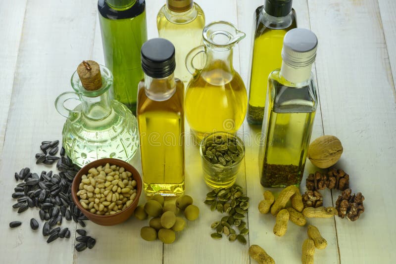 Bottles with Different Types of Oil Stand on a Table Stock Photo ...