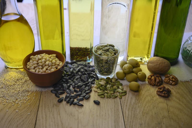 Bottles with Different Types of Oil Stand on a Table Stock Photo ...