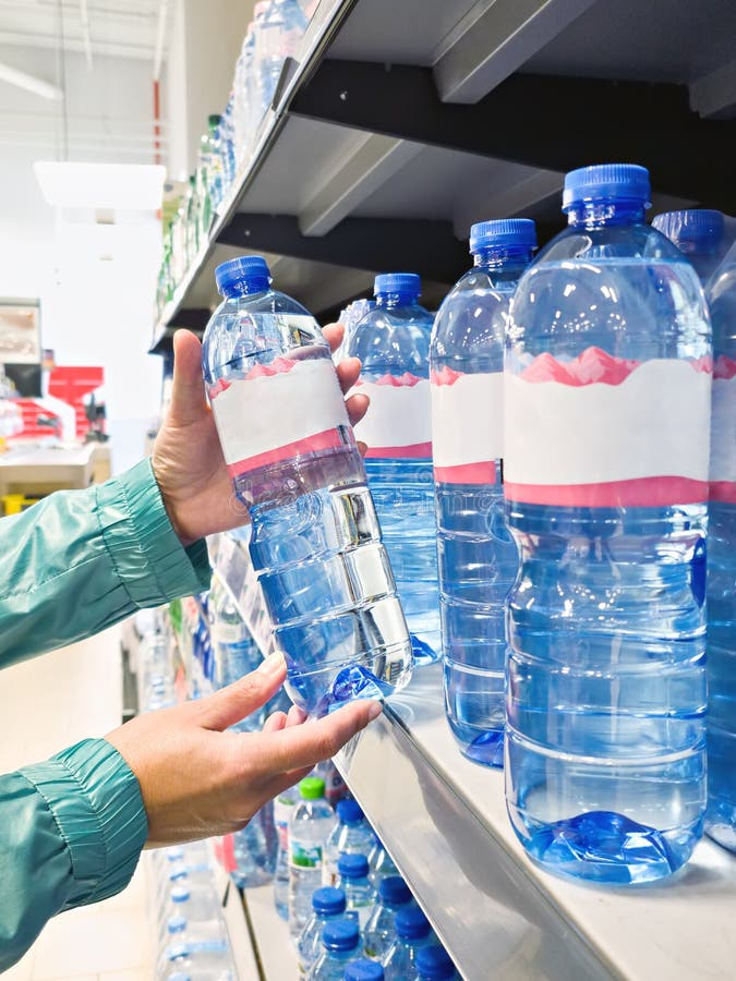 Bottles of Rinking Water in Hand at Shop Stock Image - Image of ...
