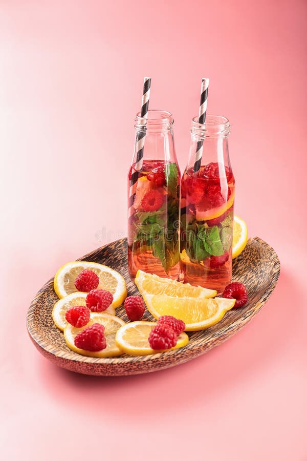 Bottles with Raspberry Oil, Fresh Berries and Raspberry Leaves O Stock ...