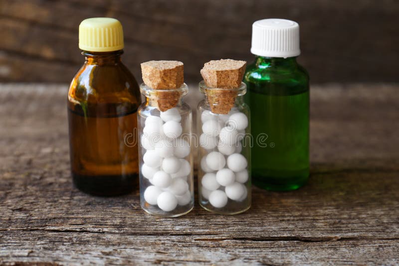 Bottles with Homeopathic Remedy on Wooden Stump Stock Image - Image of ...