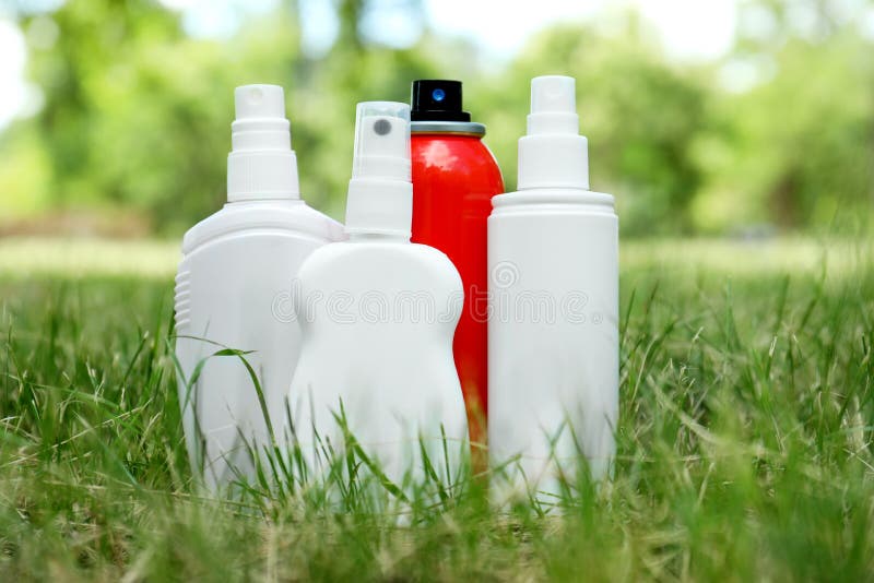 Bottles of Insect Repellent on Green Grass Stock Photo - Image of ...