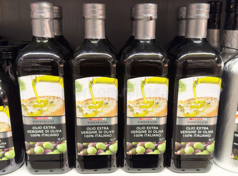 Bottles of Italian Extra Virgin Olive Oil Displayed on Shelf Editorial ...