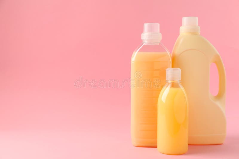 Bottles of Laundry Detergents on Pink Background. Space for Text Stock ...