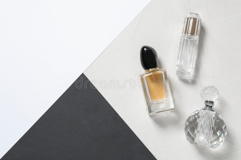 Bottles of Luxury Perfume on Color Background, Flat Lay Stock Image ...