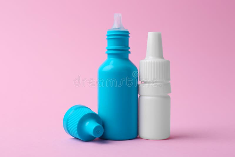 Bottles of Medical Drops on Pink Background Stock Image - Image of ...