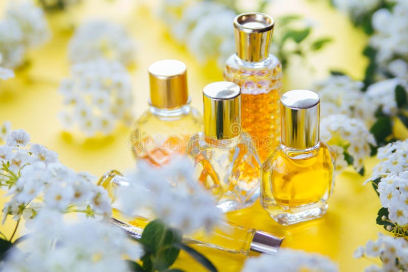 Bottles of Perfume with Flowers Stock Photo - Image of elegant ...