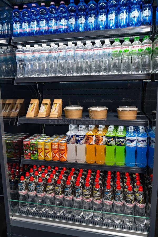Bottles of Soda Stack in Supermarket. Rows of Plastic Bottle Soda Water ...