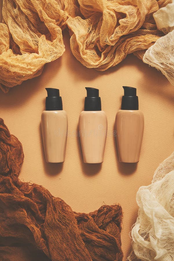 Bottles of Three Different Shades of Makeup Foundation on Beige Stock ...