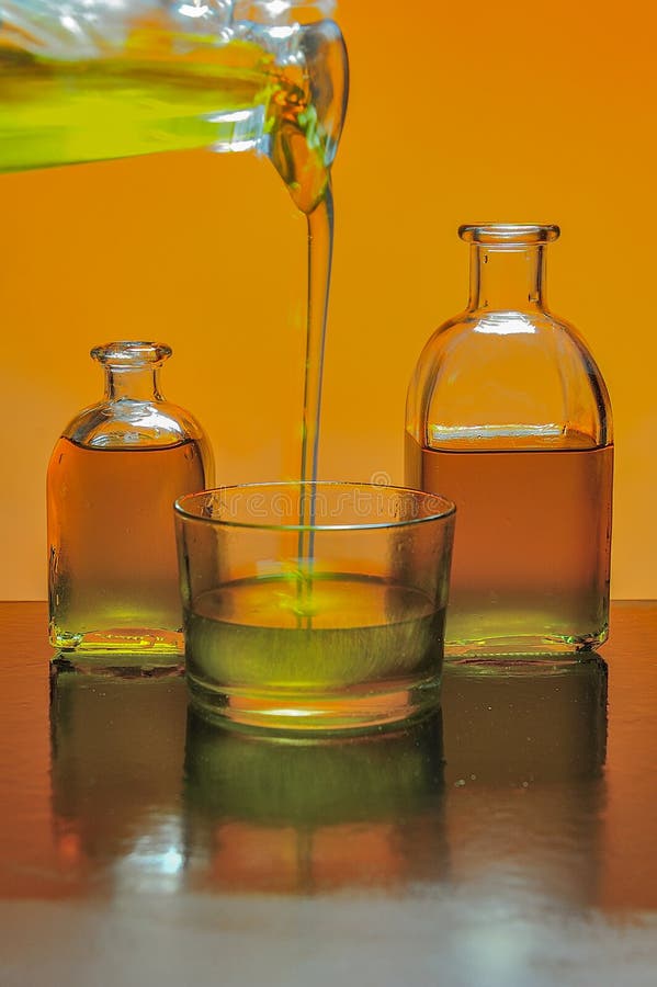 Bottles of Virgin Olive Oil, with Colored Background. Stock Photo ...
