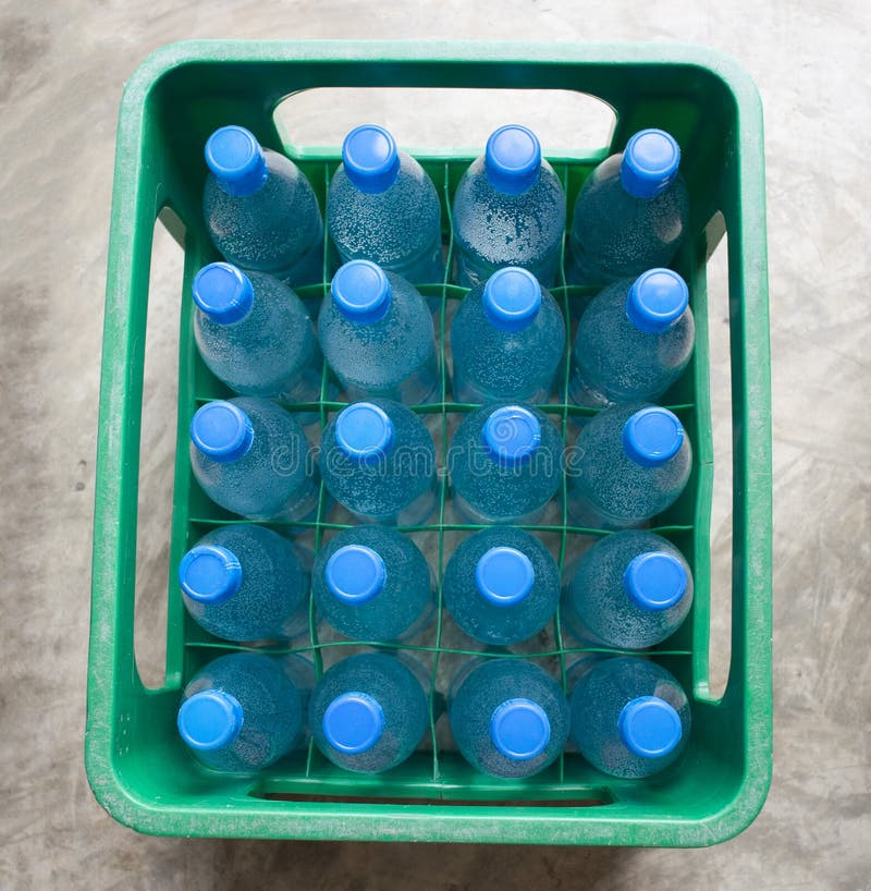 Bottles of Water in Green Crate Stock Image - Image of blue, cage: 69707305
