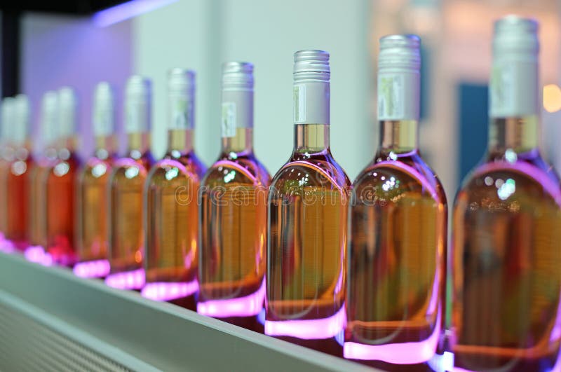 Bottle_row stock image. Image of rack, closure, liquid - 179993067