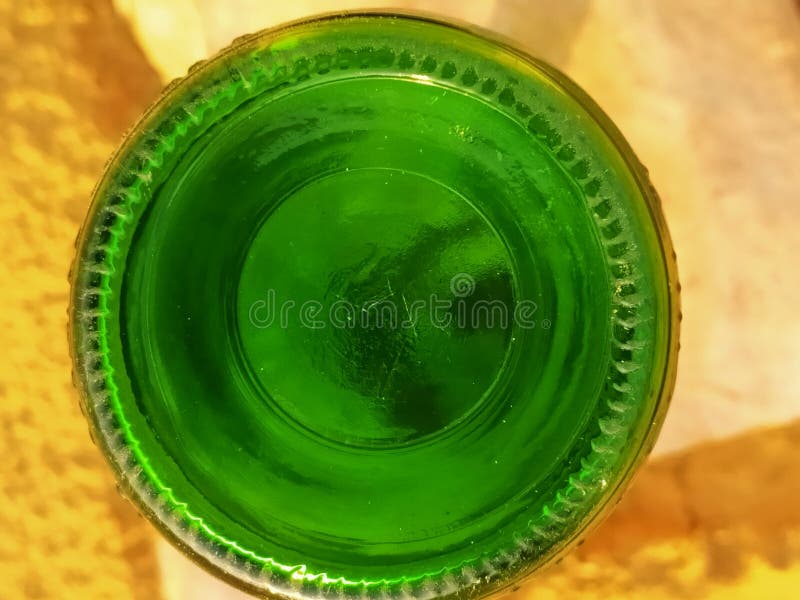 Bottom of a Green Glass Bottle Stock Photo - Image of glass, green ...