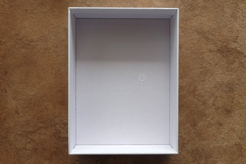 Bottom Half of Empty White Box Against a Brown Background Stock Photo ...