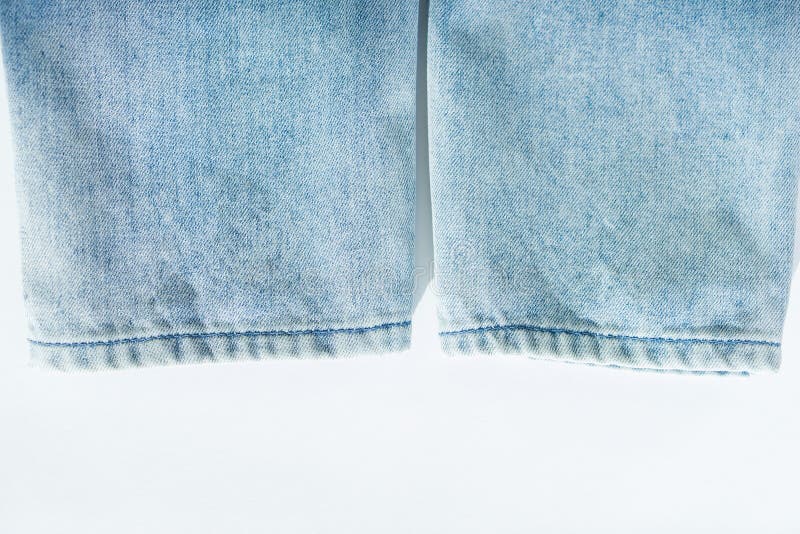Bottom of Light Blue Jeans on White Background. Stock Photo - Image of ...