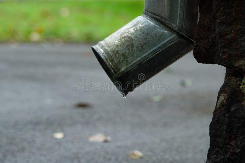Bottom part of a downspout stock photo. Image of grass - 268851744