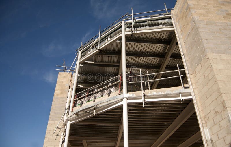 Bottom-up Perspective of Building Construction Site with Blue Sky ...