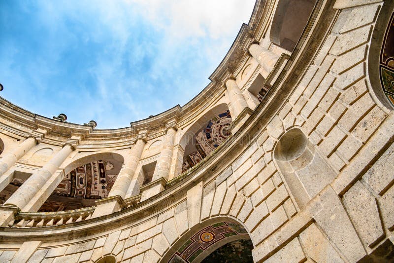 Bottom Up View of a Part of an Old Rounded Stone Building and Blue Sky ...