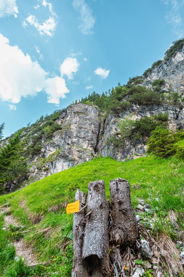 Bottom Up View of a Steep Stone Cliff Wall with a Via Ferrata for ...