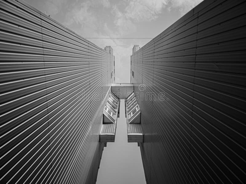 Bottom-up View of the Two Walls of a Modernist Building Connected by a ...