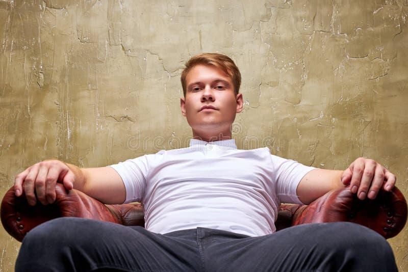 Bottom View, from Below on Bossy Caucasian Man on Leather Chair Sofa ...