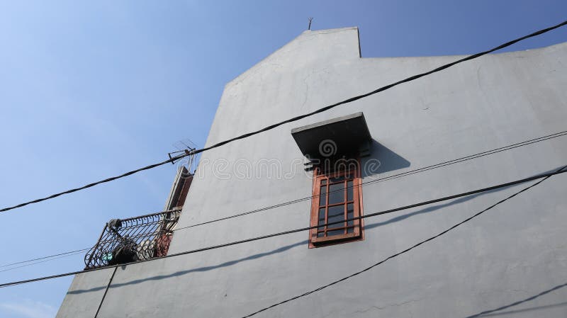 Bottom View of Building Wall with Clean Blue Sky Background Stock Image ...
