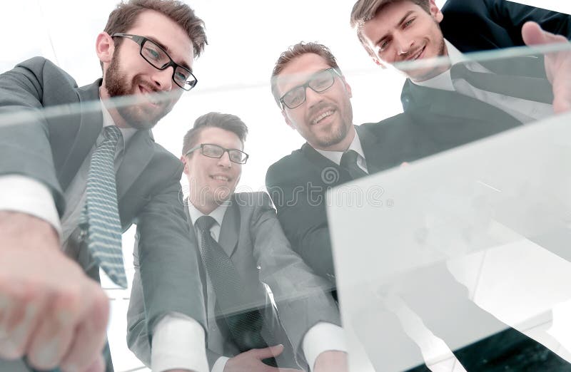 Bottom View.business Team Standing Near the Desktop Stock Image - Image ...
