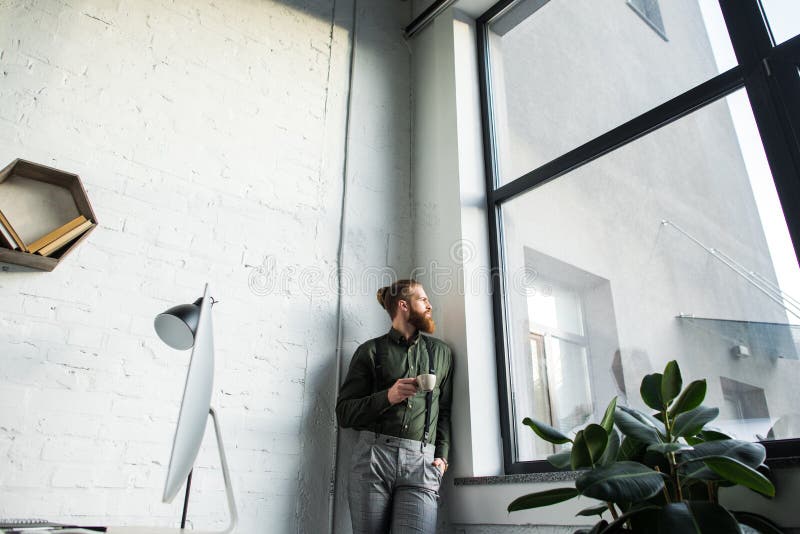 Bottom View of Businessman Standing with Cup of Coffee and Looking ...