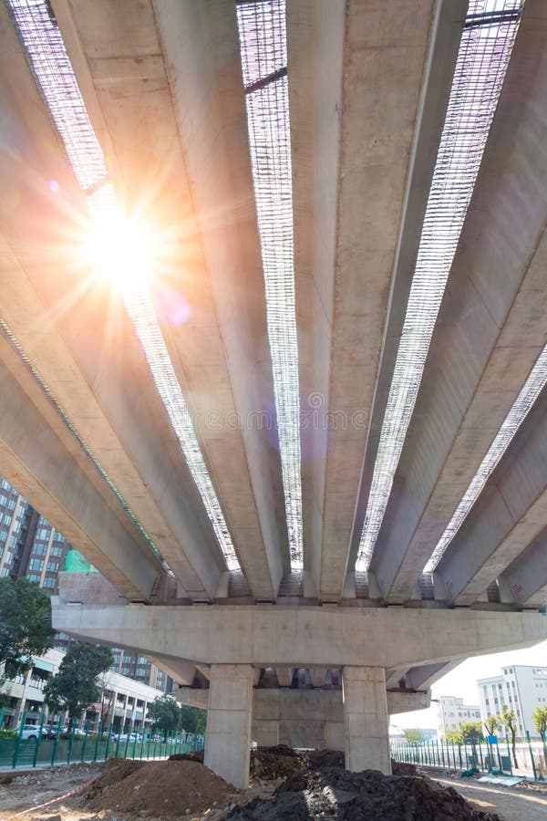 Bottom View of Concrete Highway Under Construction Against the Sun at ...