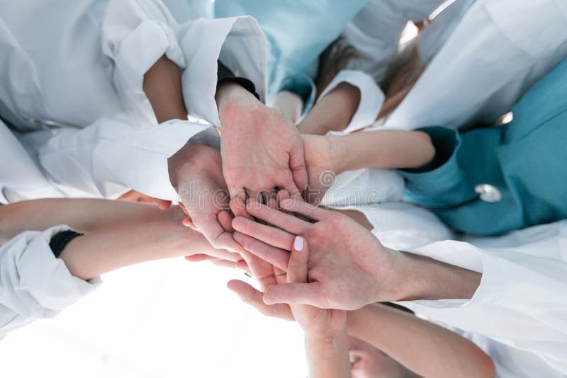 Bottom View. Group of Diverse Doctors Showing Their Unity Stock Photo ... Bottom View. Group of Diverse Doctors Showing Their Unity Stock Photo ...
