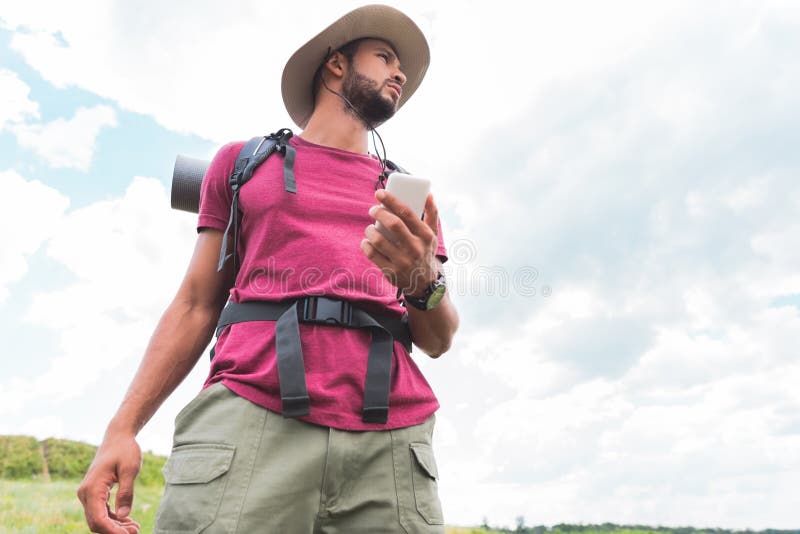 Bottom View of Handsome Traveler with Backpack Using Stock Photo ...