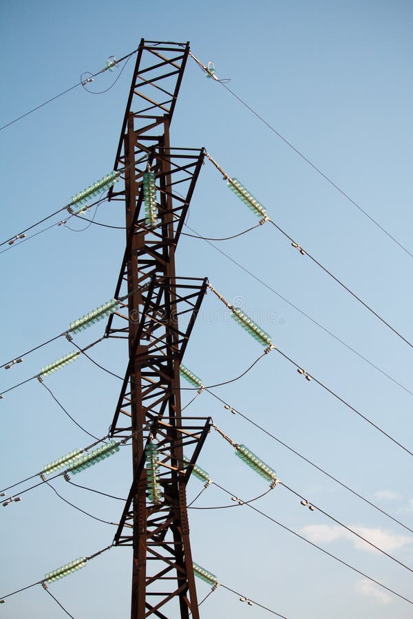 Bottom View on High Voltage Power Lines Against the Blue Cloudless Sky ...