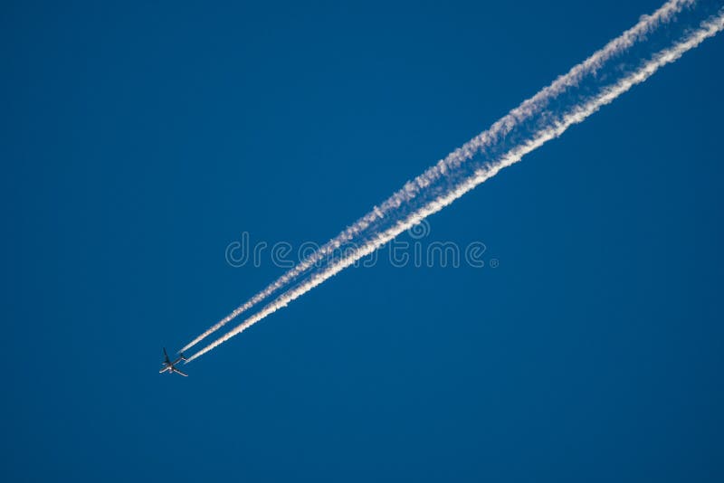Bottom View of Jet with Trail and Clear Sky Stock Photo - Image of ...