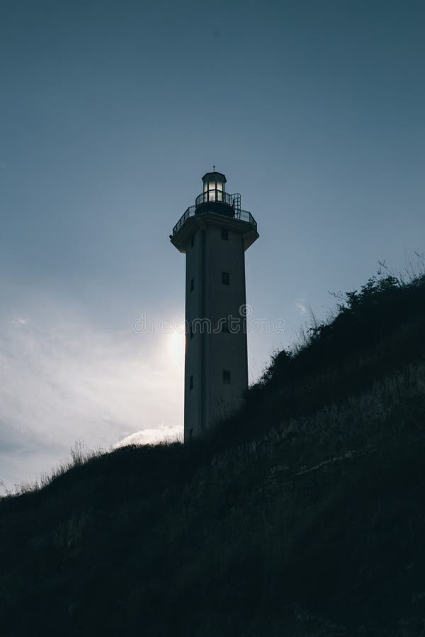 Bottom View of a Lighthouse Hiding the Sun Stock Image - Image of ...