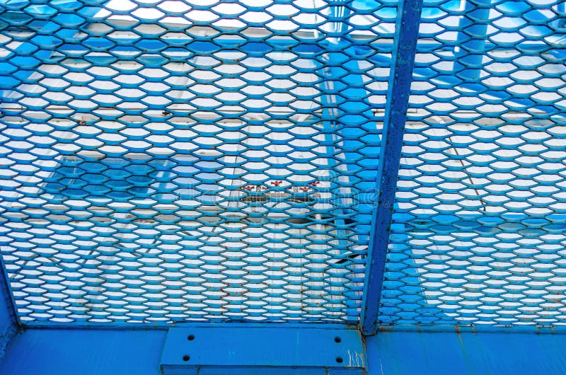 Bottom View through a Metal Blue Industrial Mesh Stock Image - Image of ...