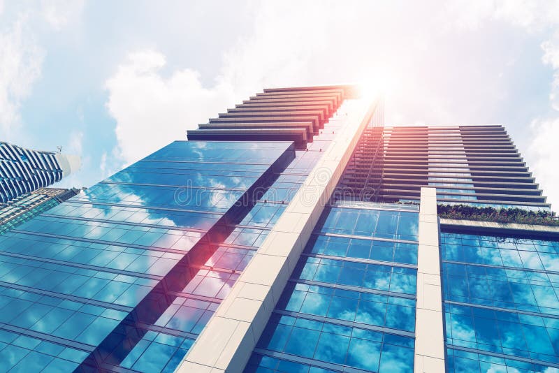 Bottom View of Modern High Building in Business District at Suns Stock ...